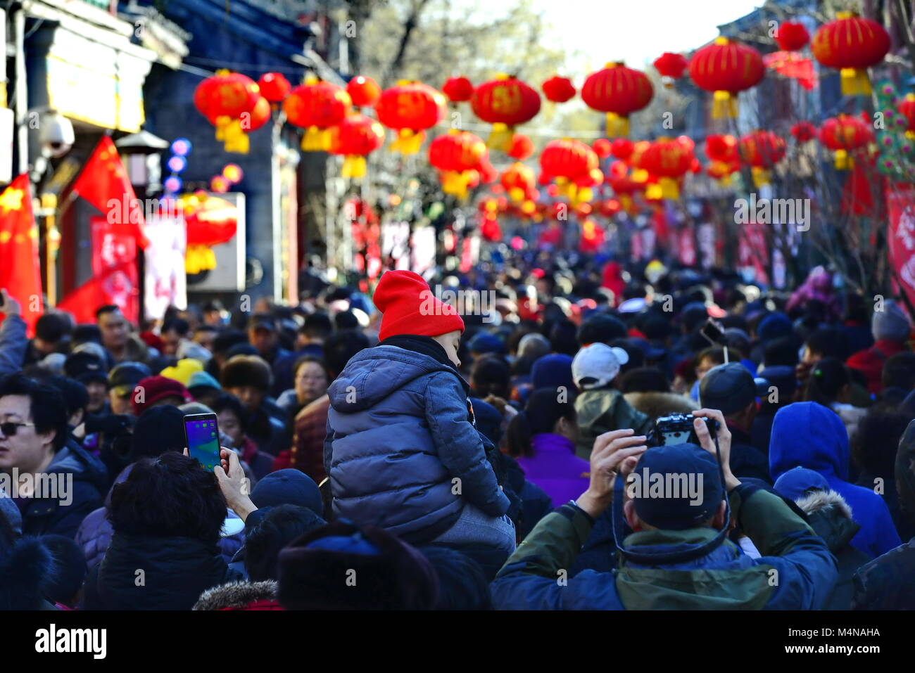 Beijing, China. 16th Feb, 2018. Tourists visit Changdian temple fair in ...