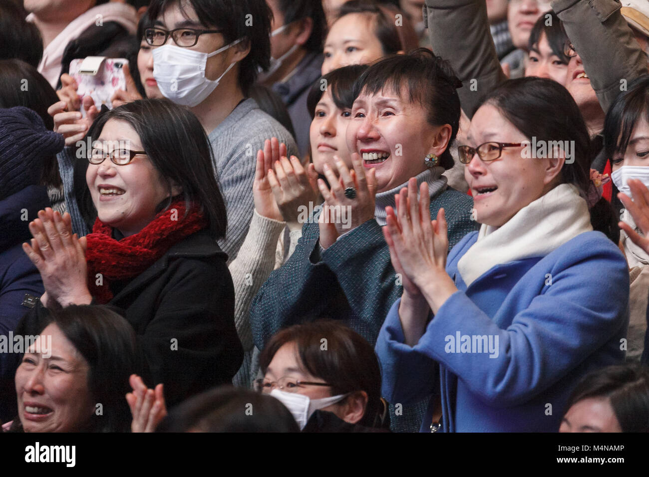 Crowds gather to watch a super high vision 8K screen broadcasting ...