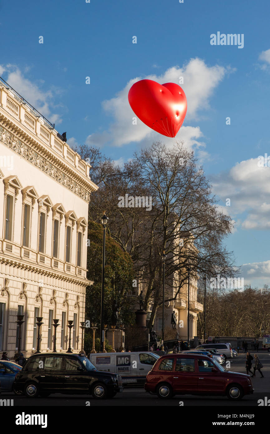 London, UK. 17th February, 2018. An inflatable heart floats above Pall ...