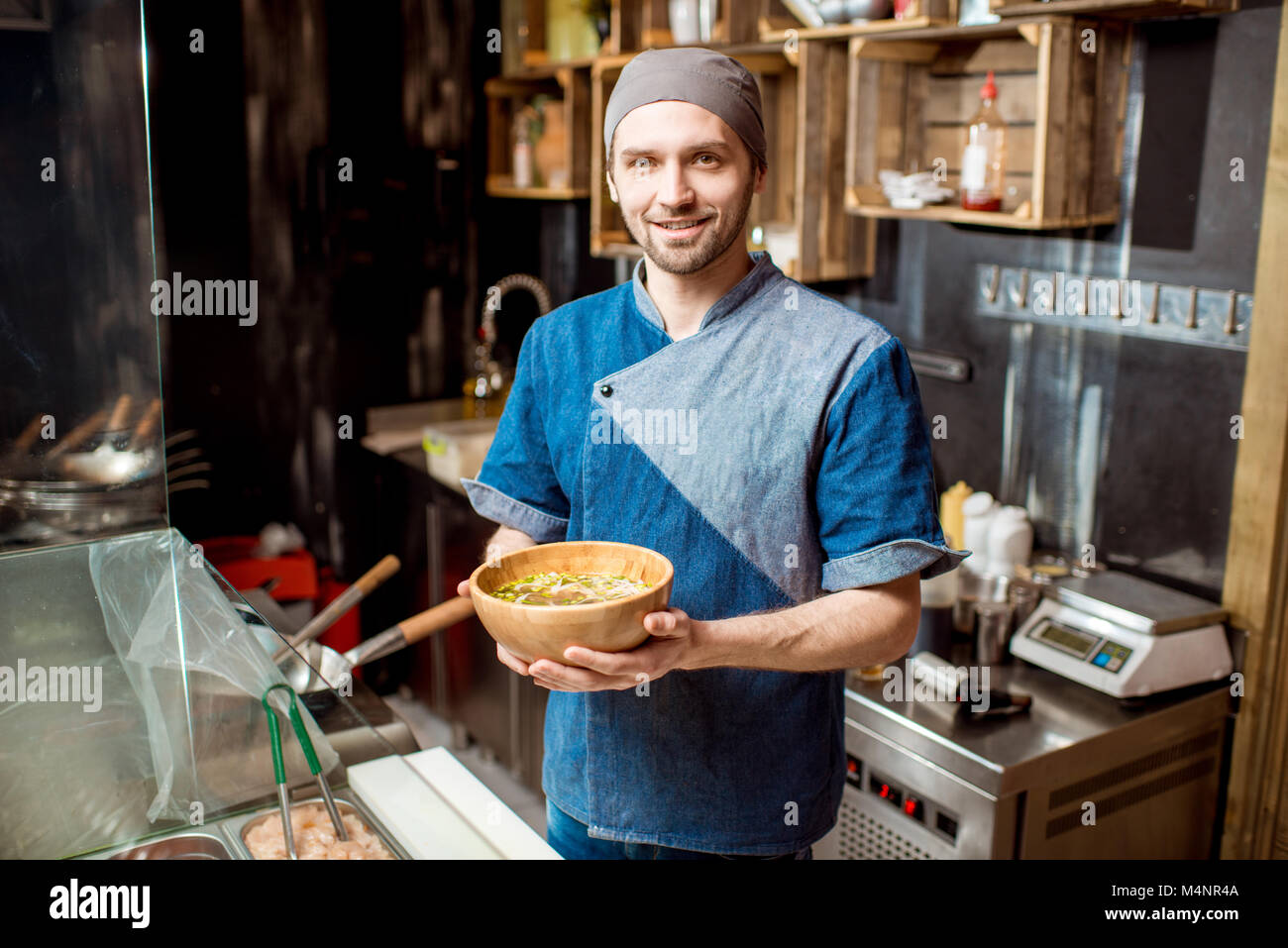 Chief cook at the asian restaurant kitchen Stock Photo - Alamy