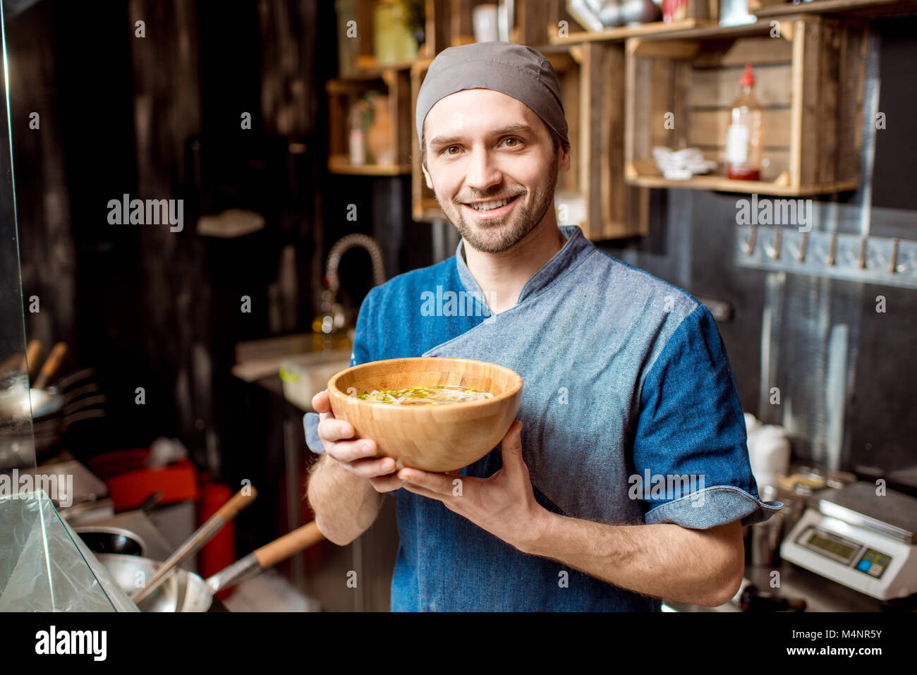 Chief cook at the asian restaurant kitchen Stock Photo - Alamy