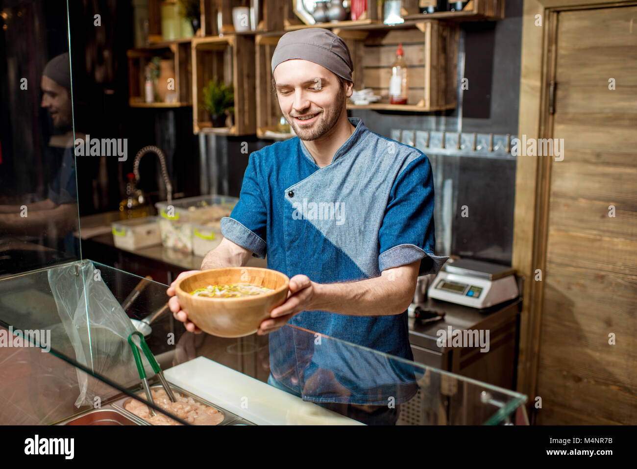 Chief cook at the asian restaurant kitchen Stock Photo - Alamy