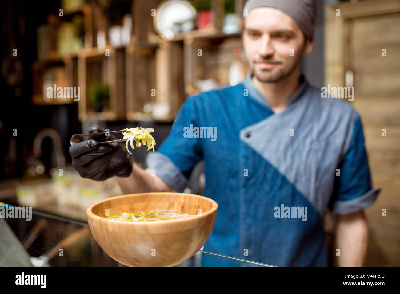 Chief cook at the asian restaurant kitchen Stock Photo - Alamy