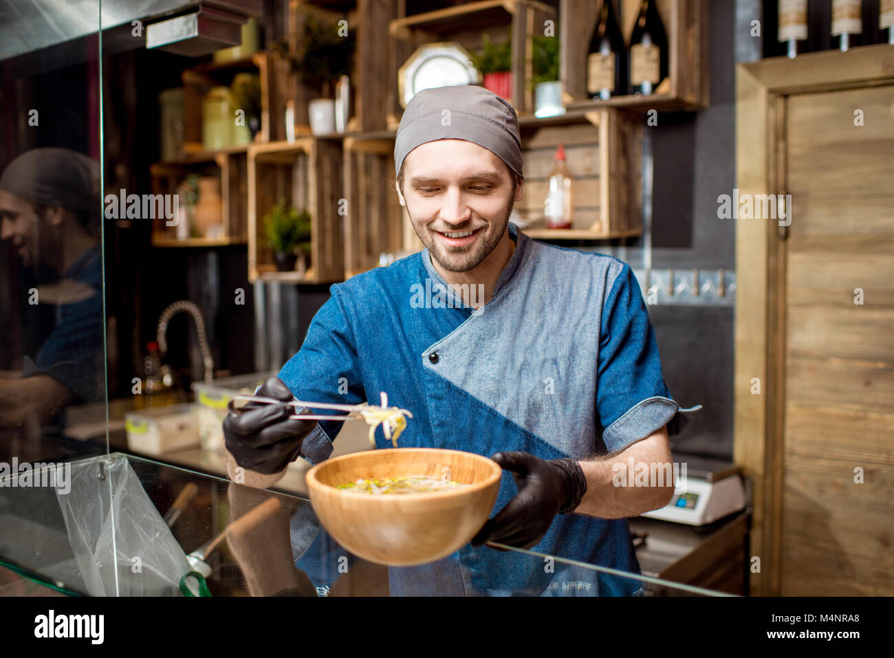 Chief cook at the asian restaurant kitchen Stock Photo - Alamy