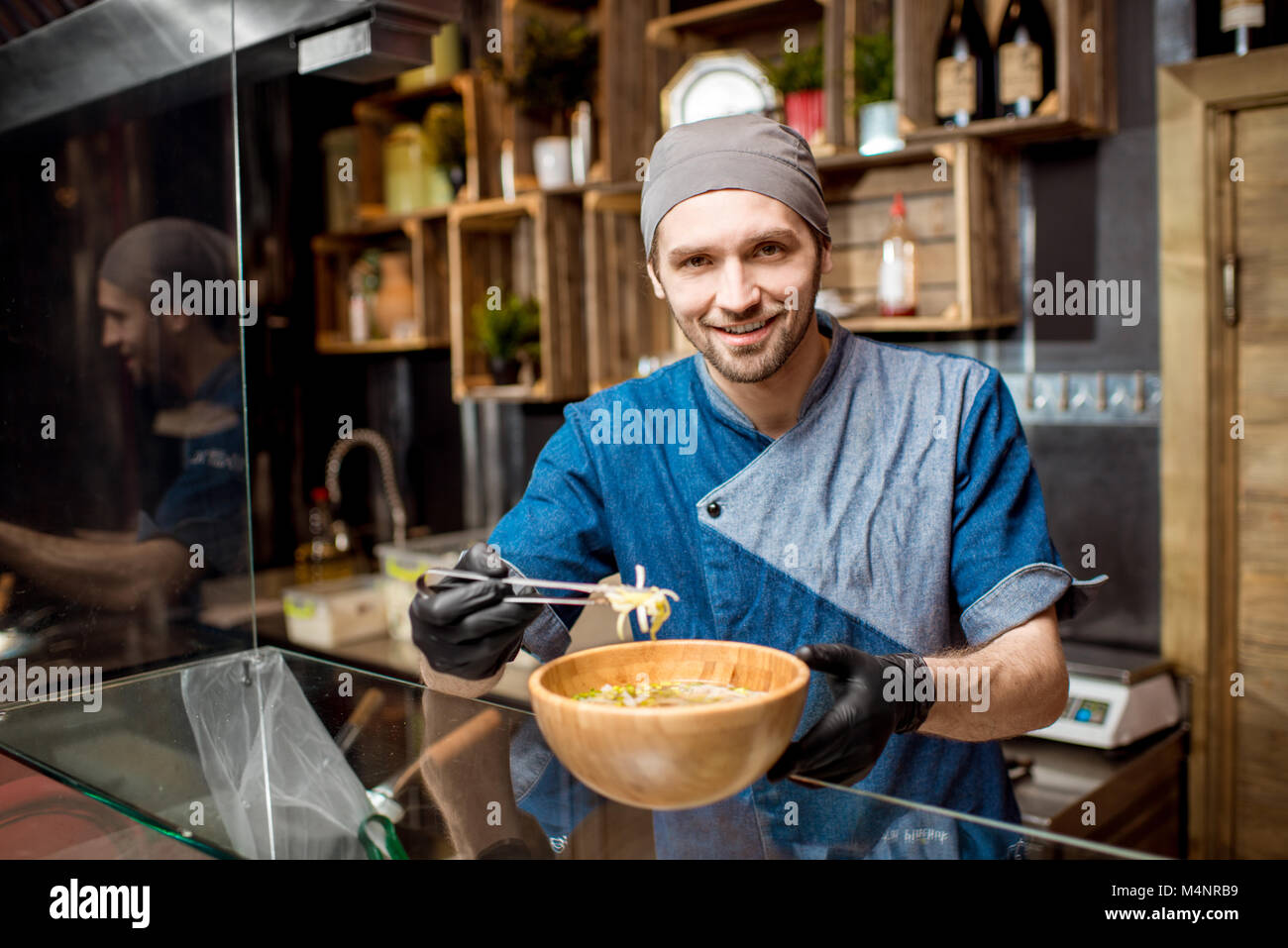 Chief cook at the asian restaurant kitchen Stock Photo - Alamy