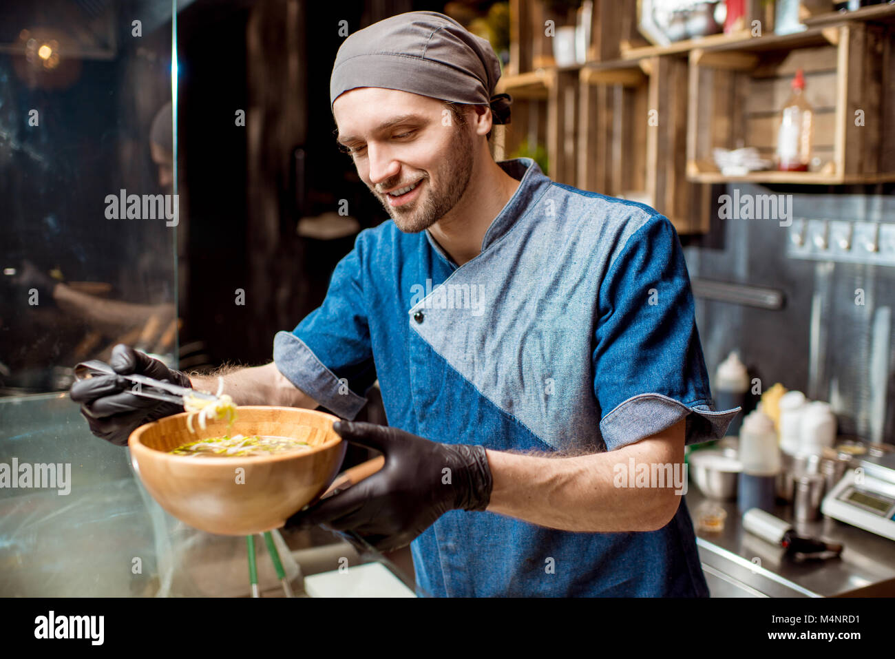 Chief cook at the asian restaurant kitchen Stock Photo - Alamy