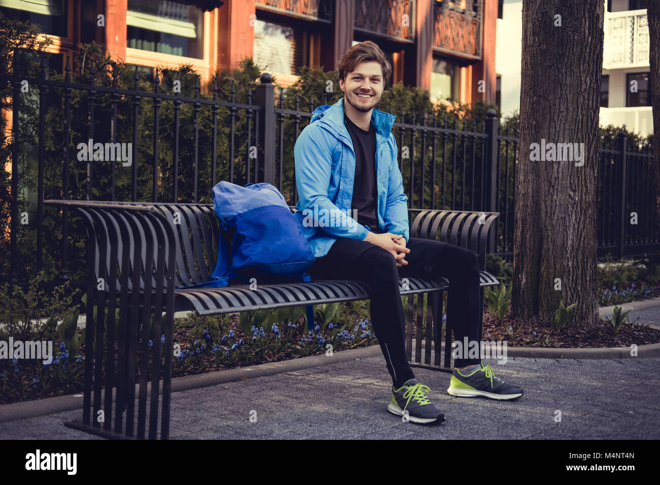 Guy sitting on bench sports hi-res stock photography and images - Alamy