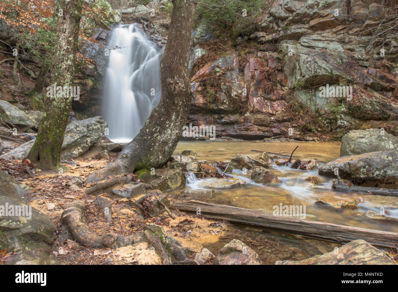 A beautiful, hard to find waterfall flows into a ravine near the top of ...