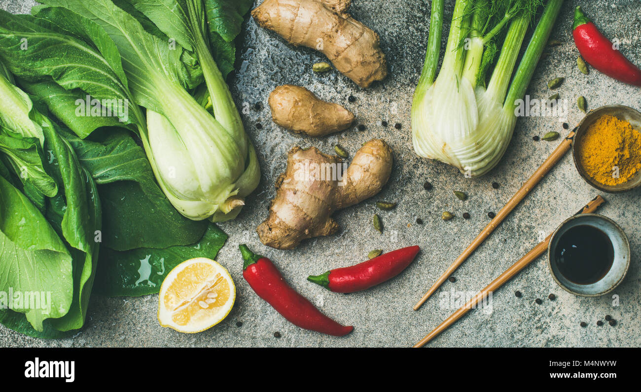 Asian cuisine ingredients over concrete background, top view. Flat-lay ...