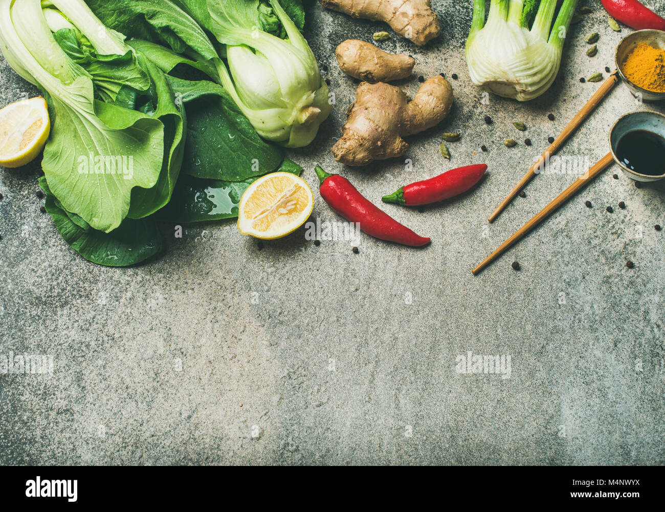Asian cuisine ingredients over concrete background, top view, copy ...