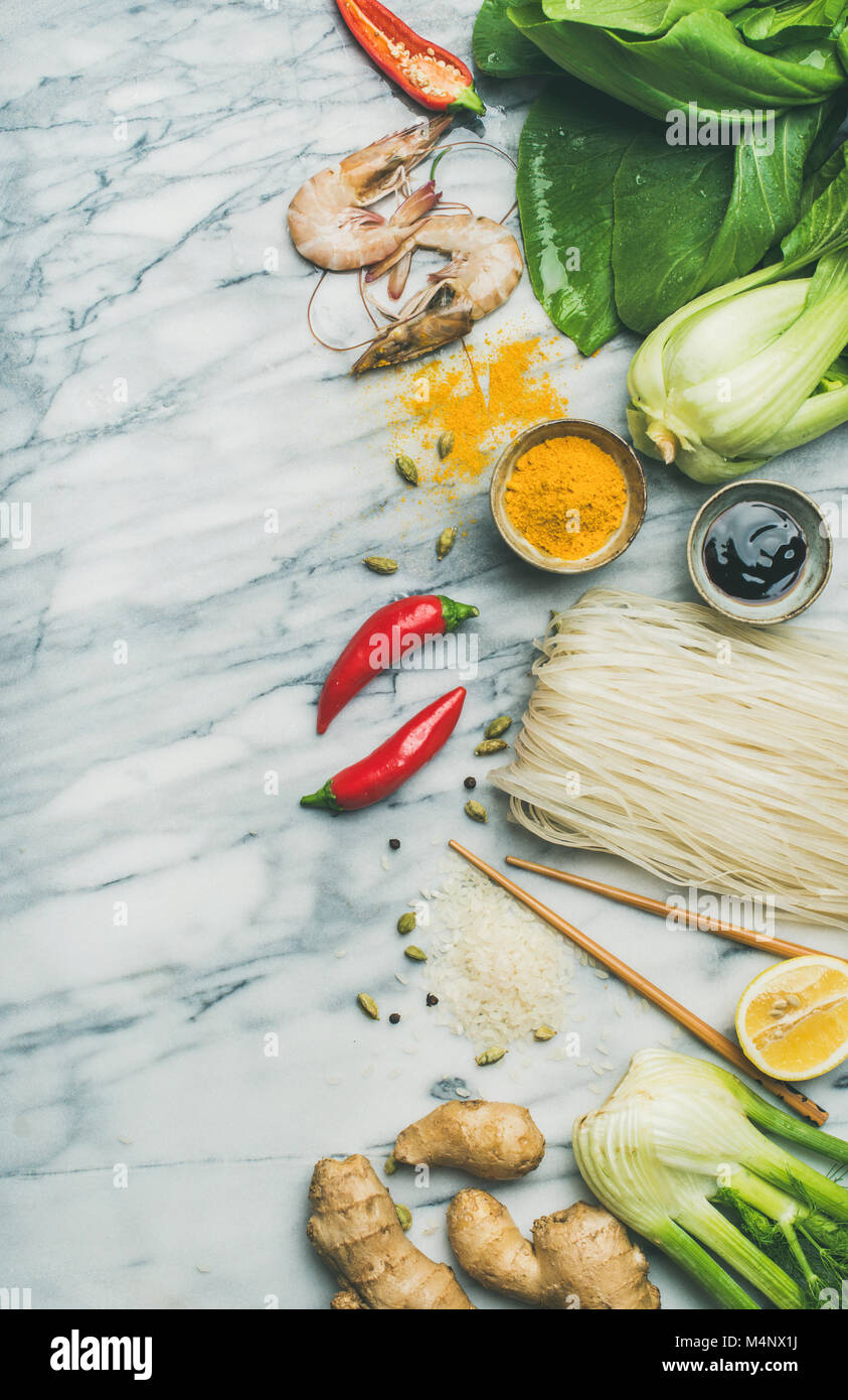 Asian cuisine ingredients over marble background, top view, copy space ...