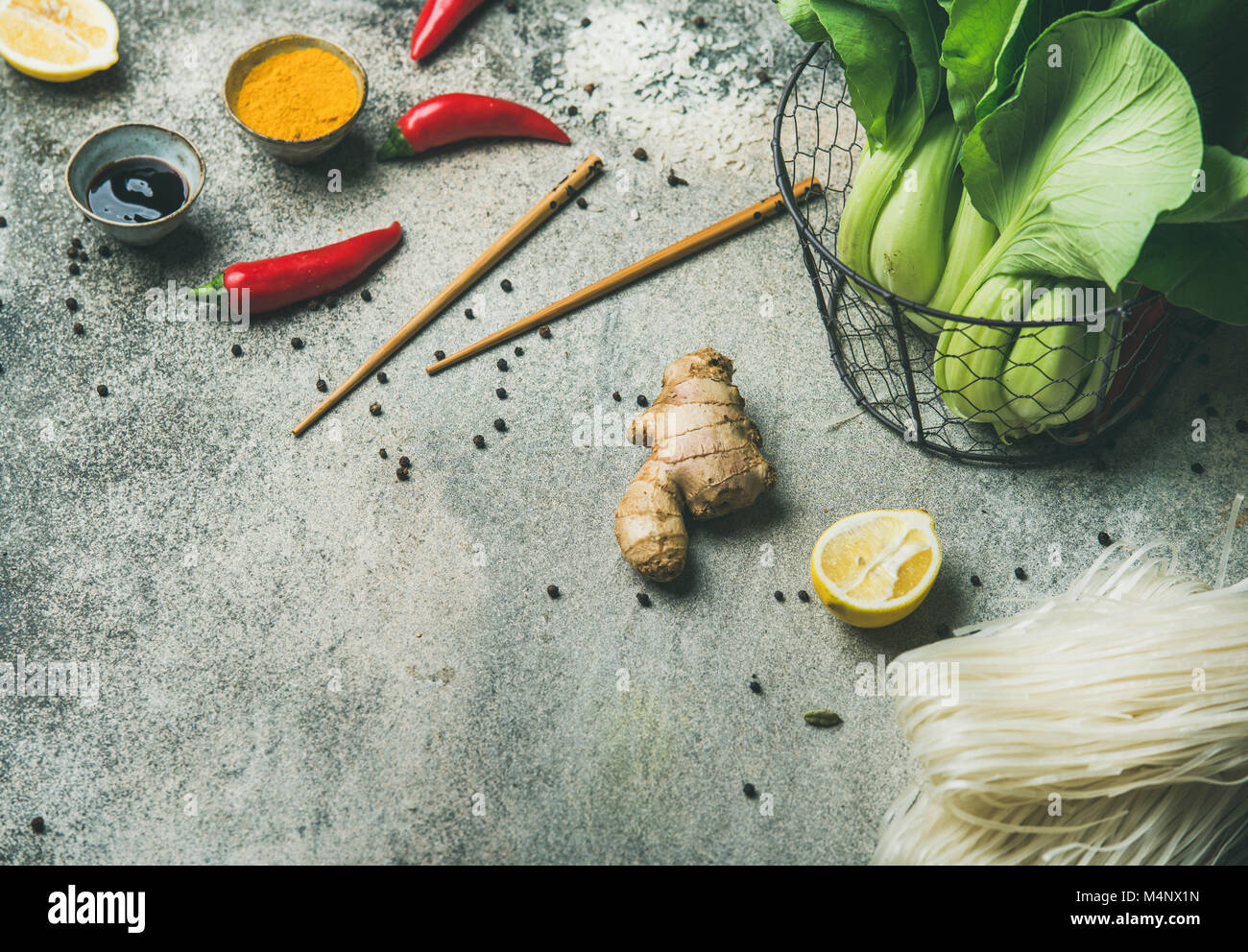 Asian cuisine ingredients over grey concrete background, copy space ...