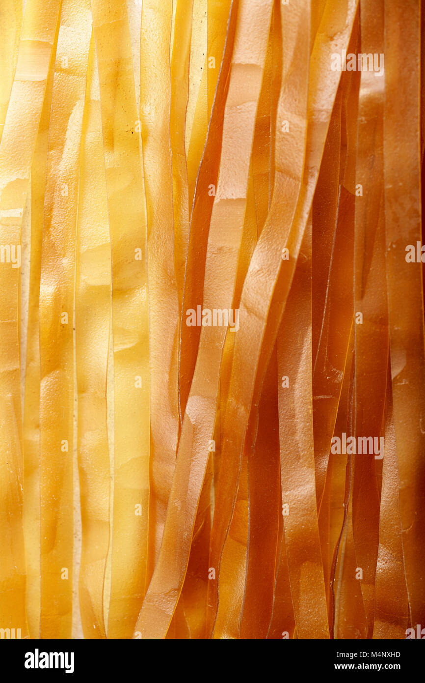Close up shot of flat and thick rice noodles made with coconut milk ...