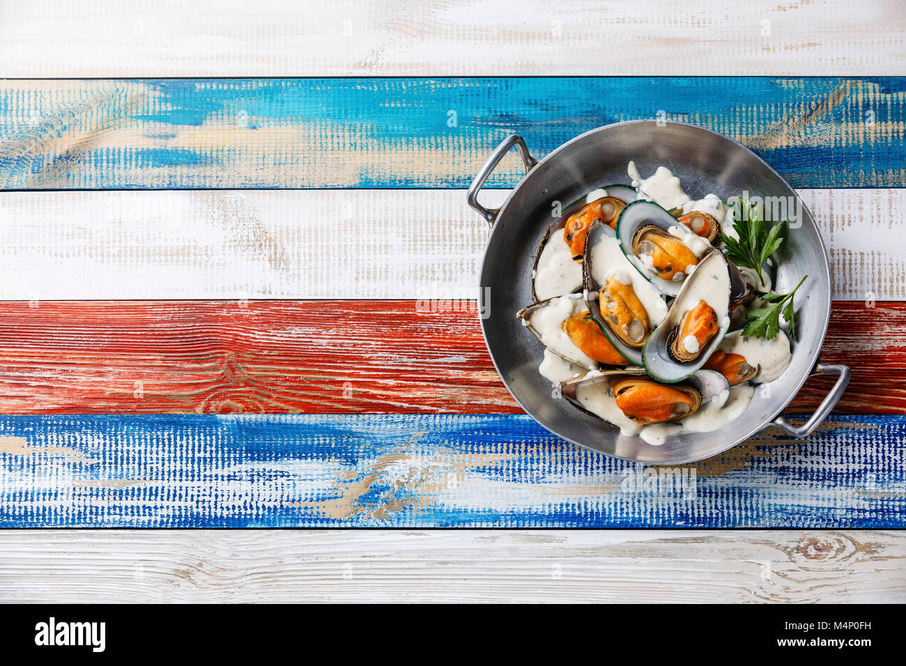 Shellfish Mussels Clams on pan with blue cheese sauce copy space Stock ...