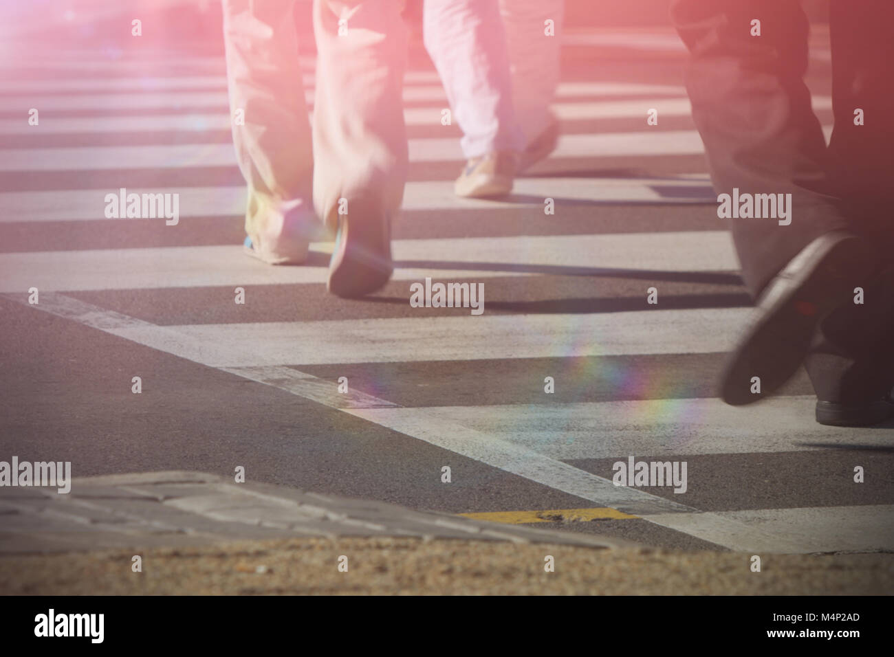 People walking on zebra crossing Stock Photo - Alamy