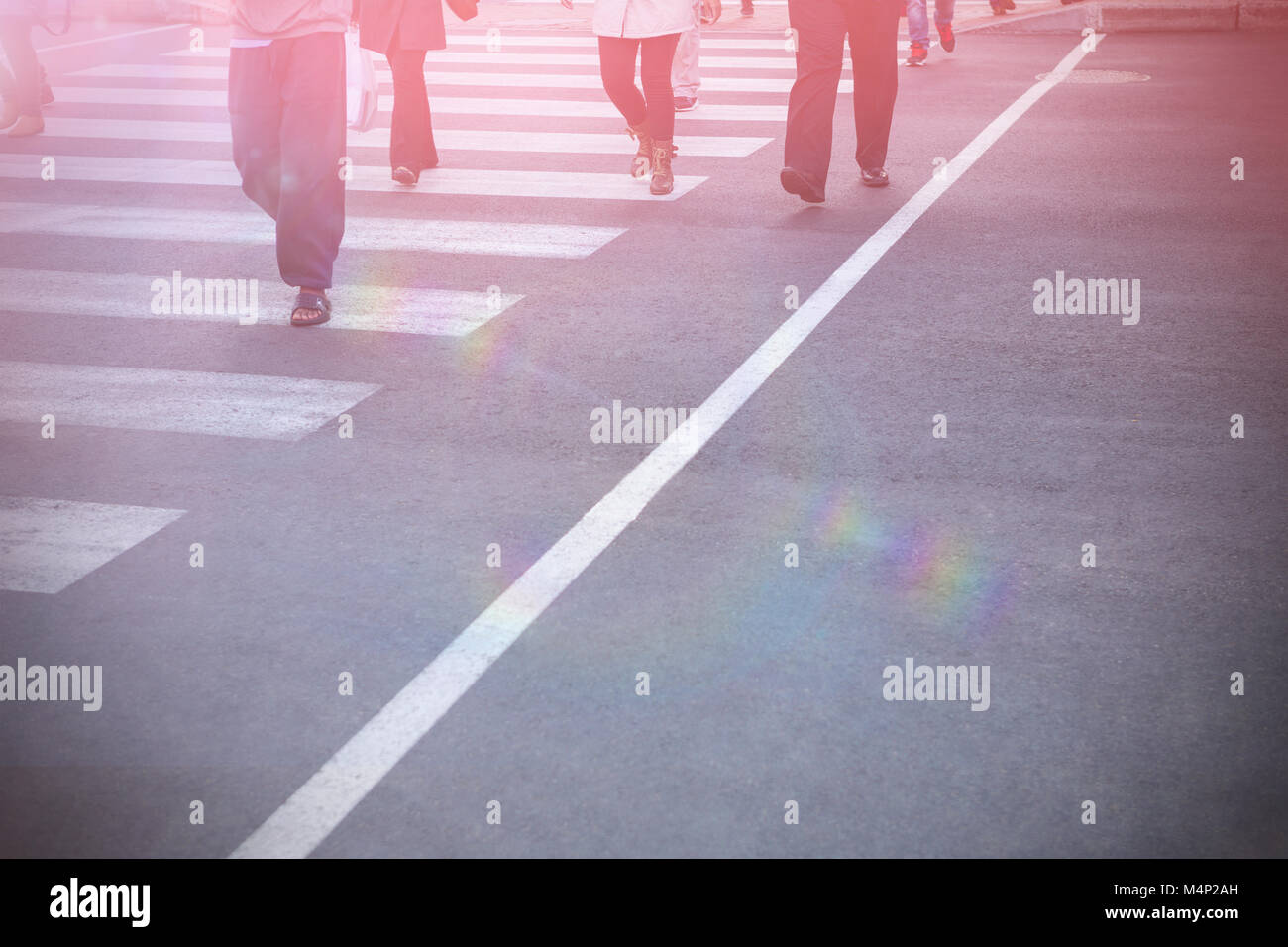 Pedestrians crossing the road Stock Photo - Alamy