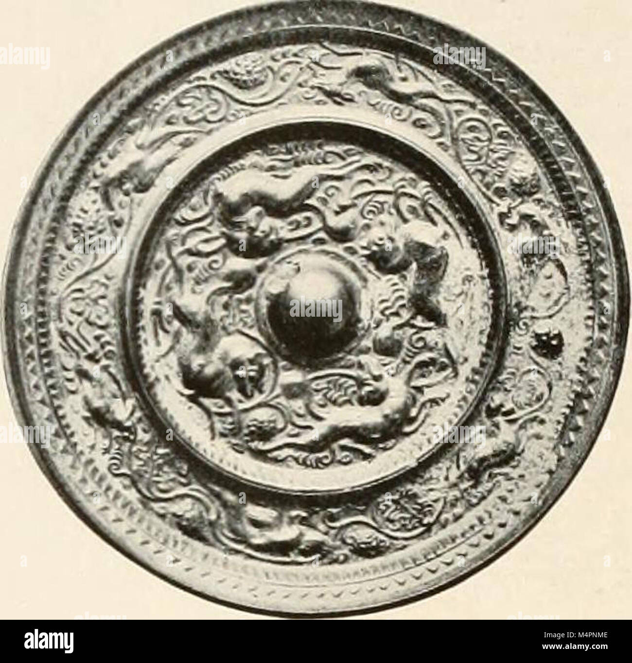 This bronze mirror from the Han Dynasty features intricate designs and ...