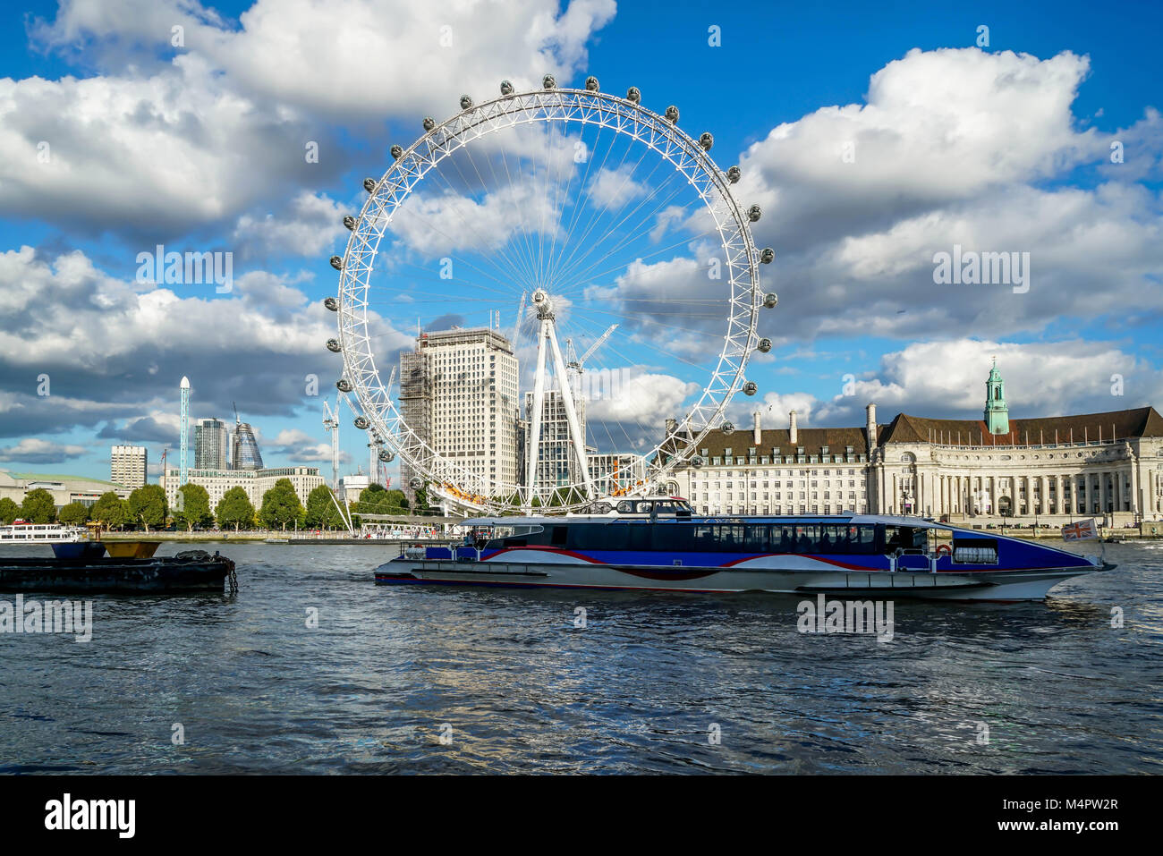 A boat on the Thames River showing the incredible sights of London ...