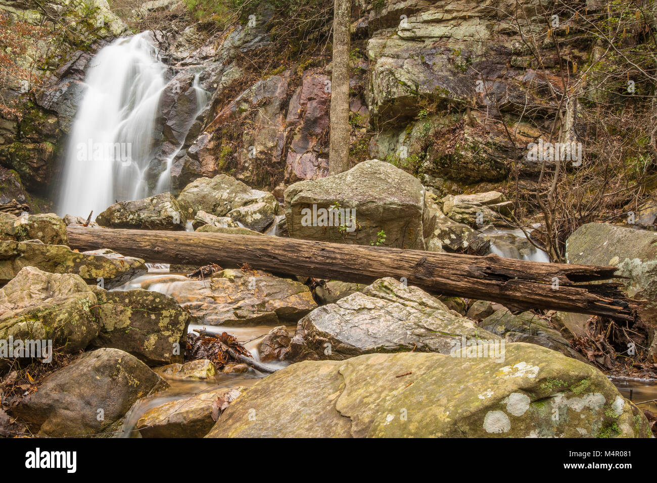 A beautiful, hard to find waterfall flows into a ravine near the top of ...