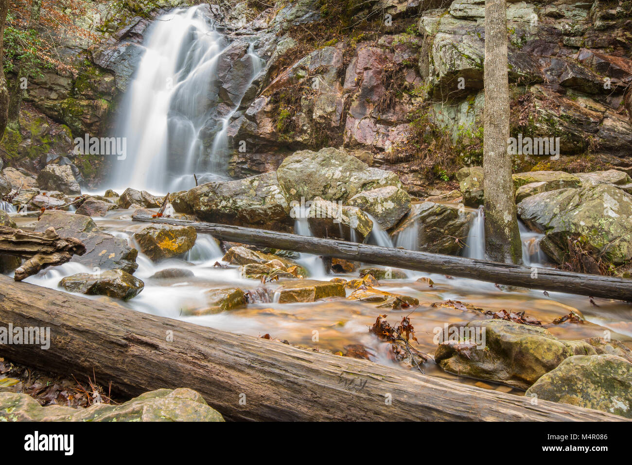 A beautiful, hard to find waterfall flows into a ravine near the top of ...