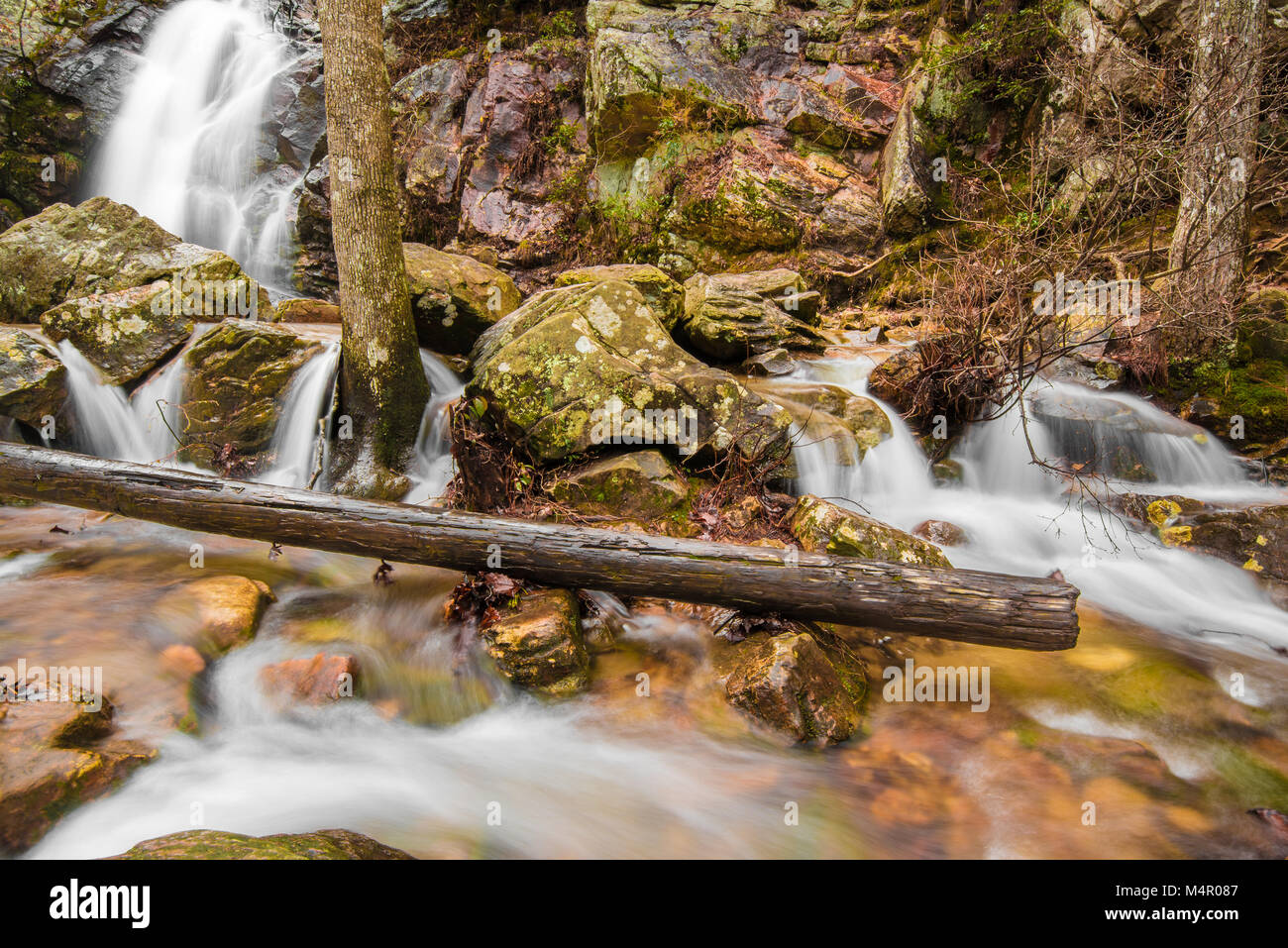 A beautiful, hard to find waterfall flows into a ravine near the top of ...