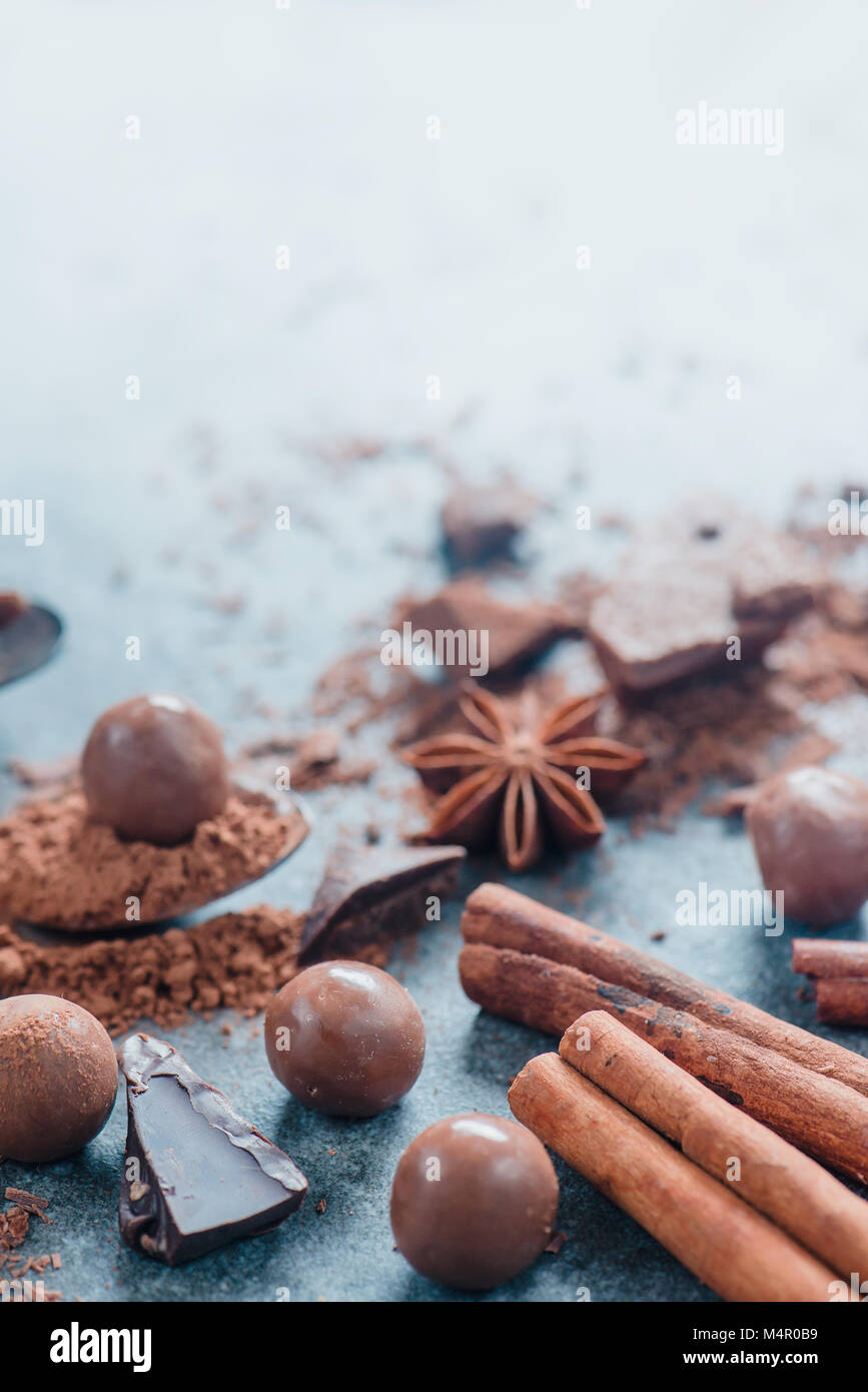 Cooking desserts and home concept. Chocolate pieces, spices, anise ...