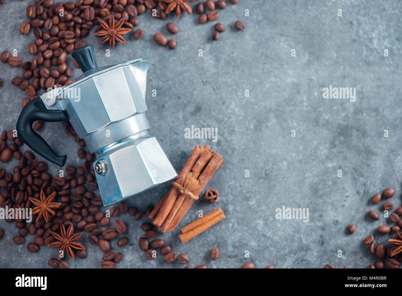 Geyser coffee maker top view with coffee beans, cinnamon, and anise ...