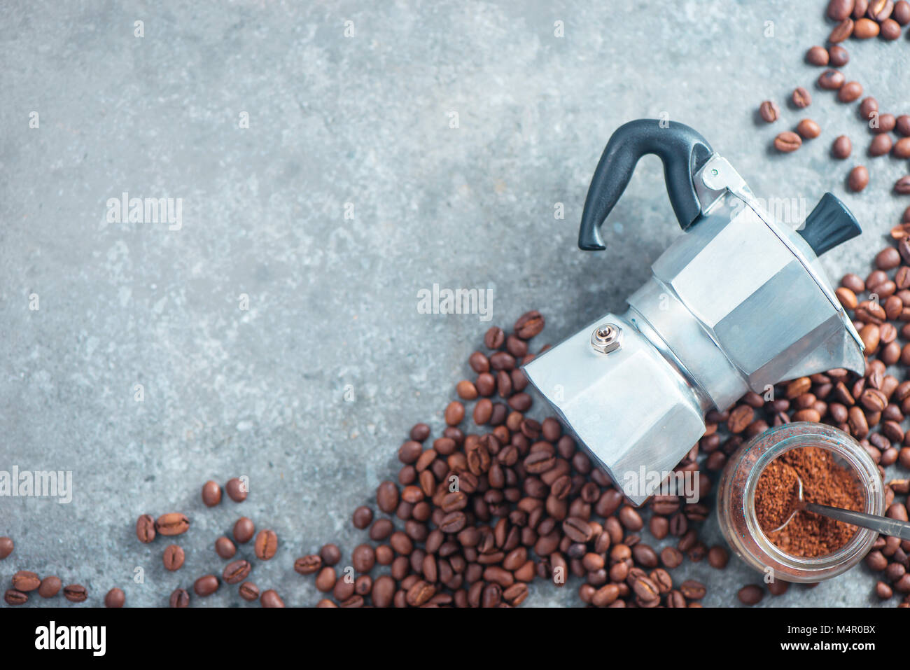 Geyser coffee maker top view with beans and ground coffee in a glass ...