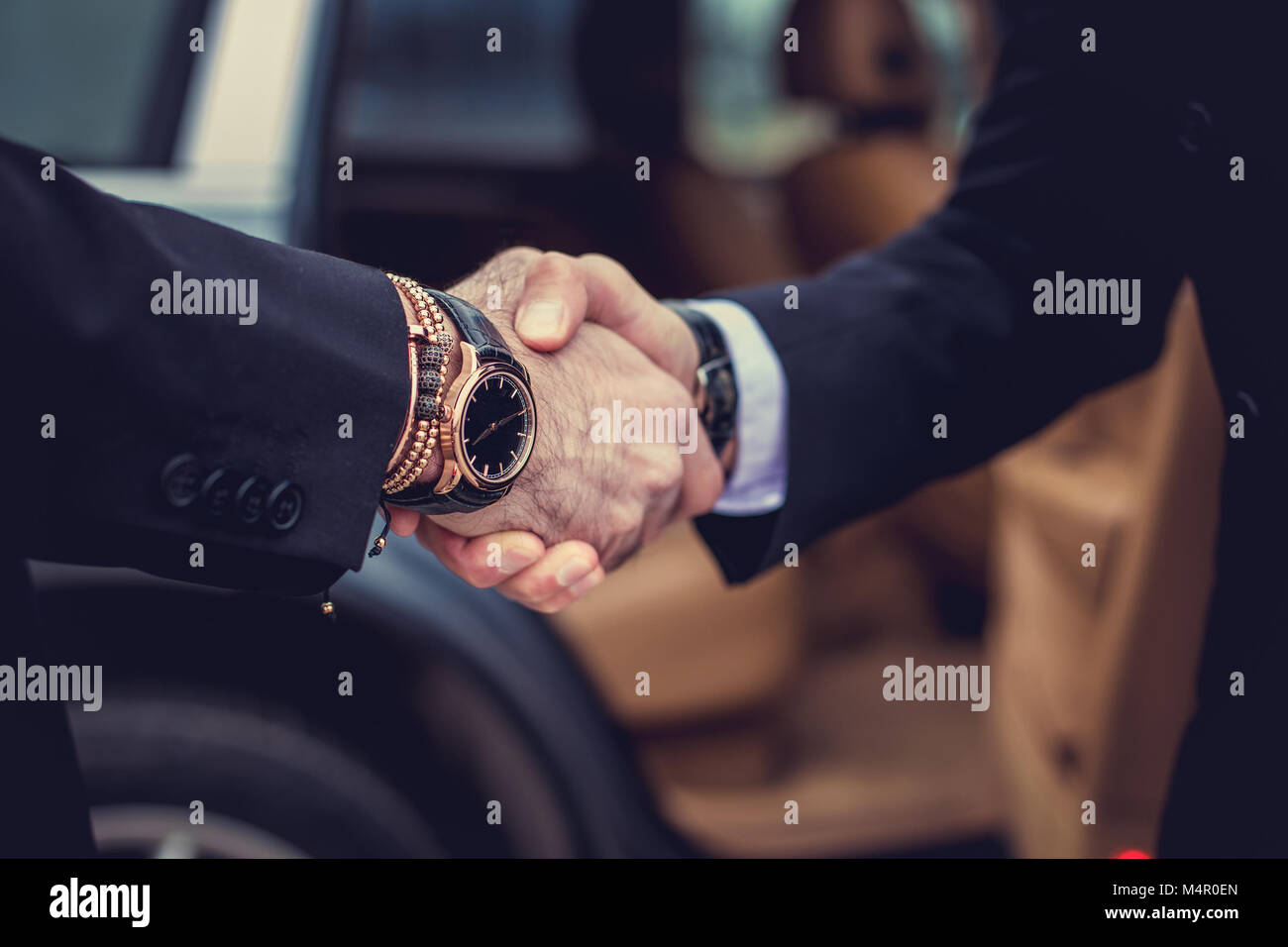 Two hands shaking car in hi-res stock photography and images - Alamy