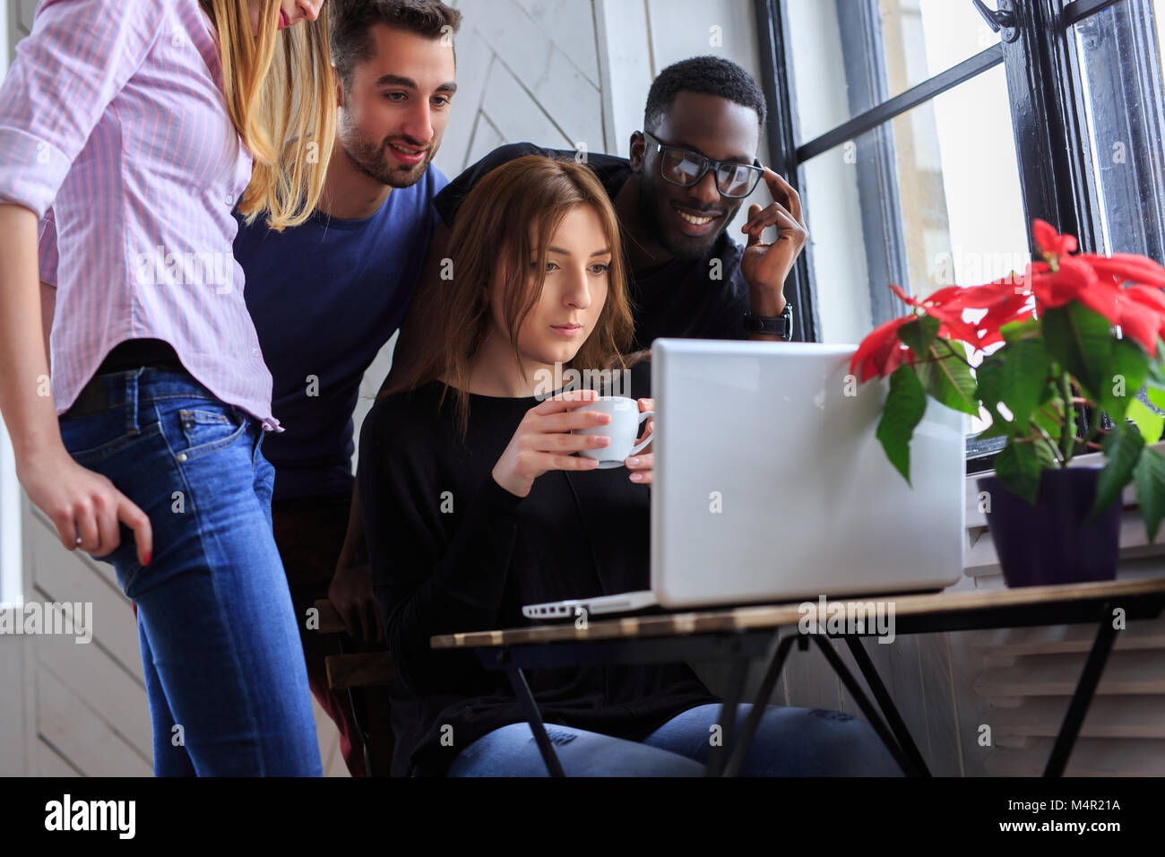 A group of international people warking with laptop Stock Photo - Alamy