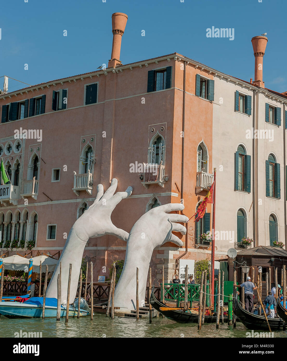 VENICE, ITALY - August 2017: Monumental hands rise from the water in ...