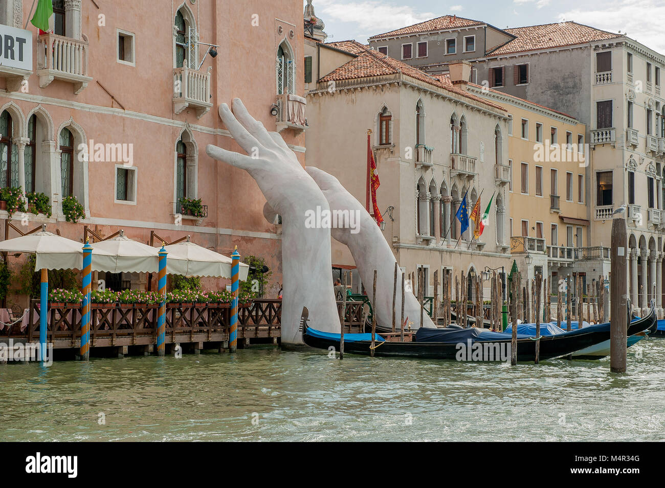 VENICE, ITALY - August 2017: Monumental hands rise from the water in ...