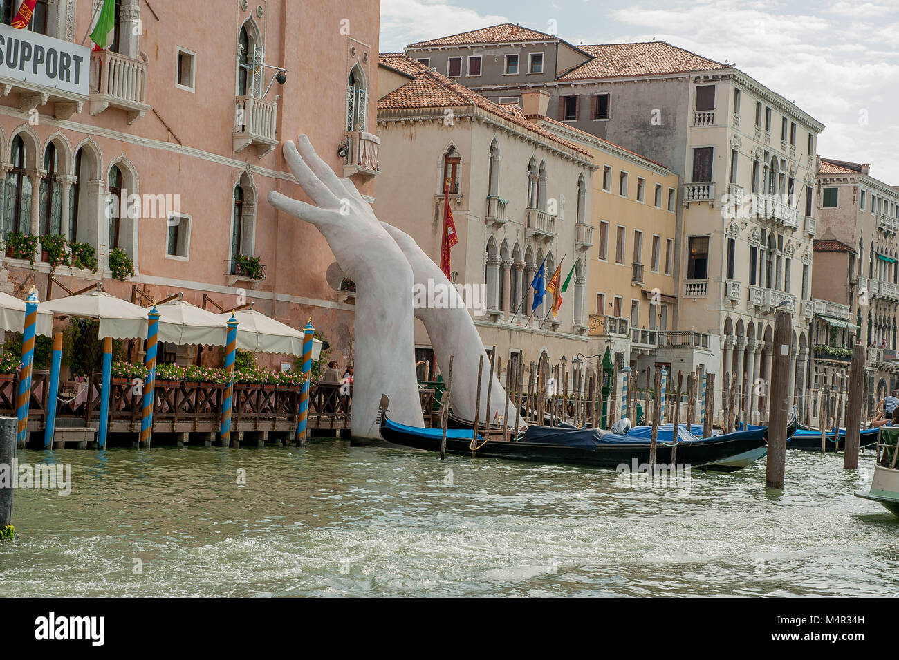 VENICE, ITALY - August 2017: Monumental hands rise from the water in ...