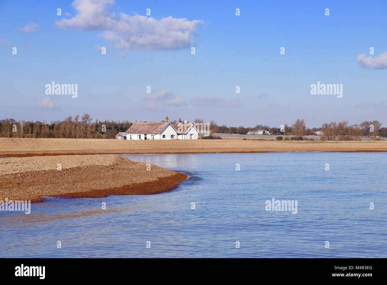 Bright winter sunshine and blue skies at Shingle Street near Woodbridge ...