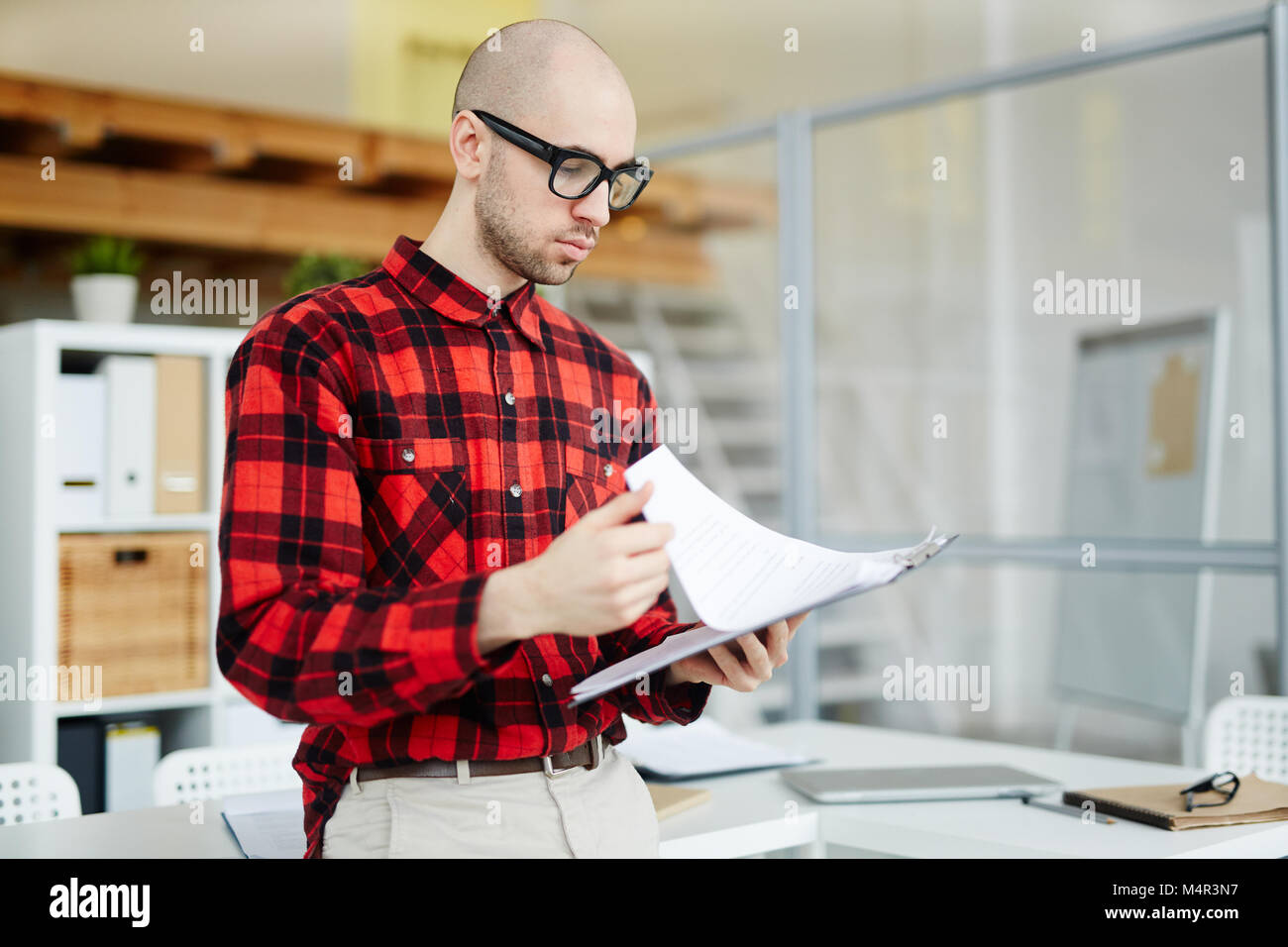 Man reading notes Stock Photo - Alamy
