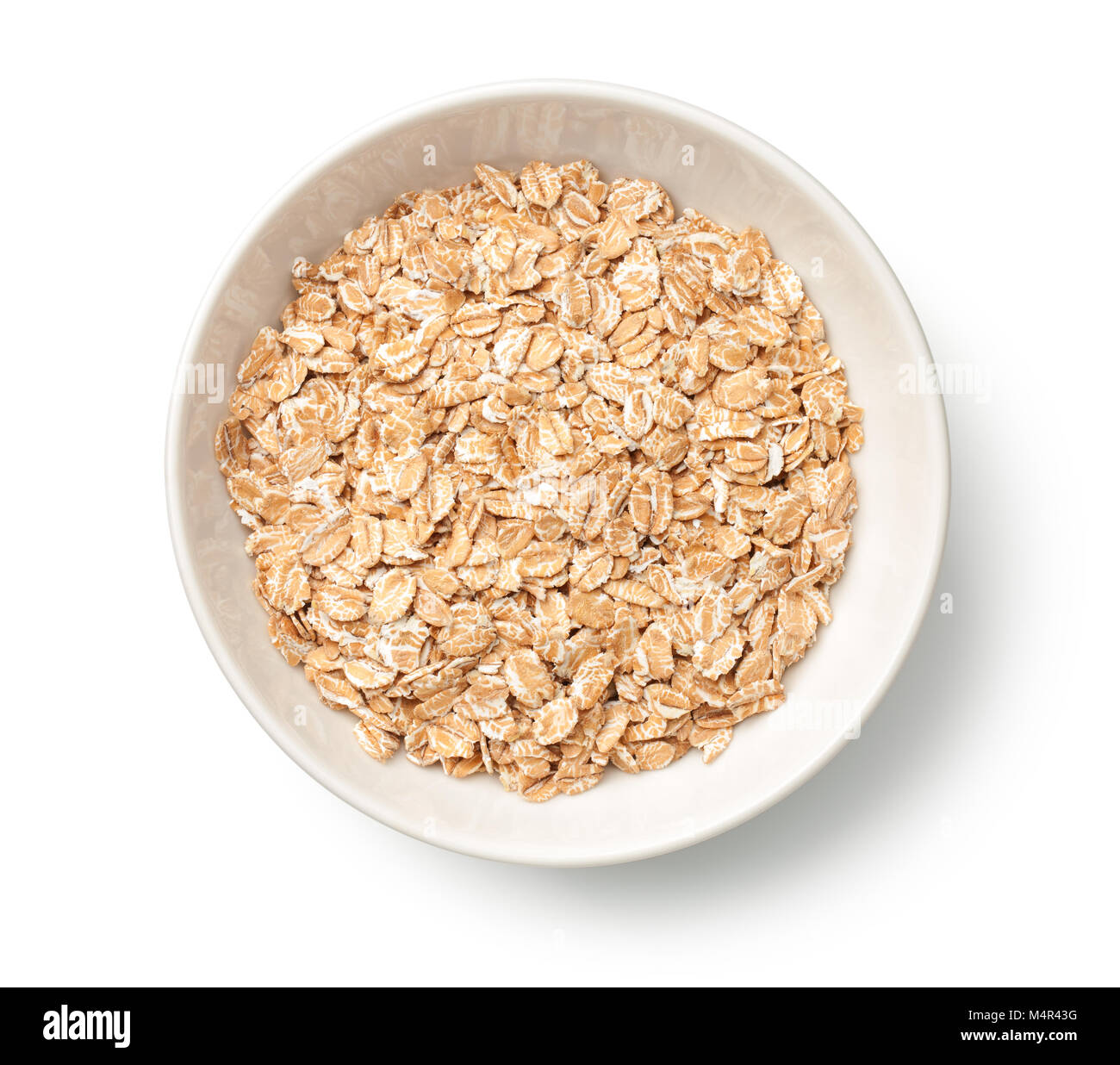 Oat rye flakes in bowl isolated on white background. Top view Stock ...