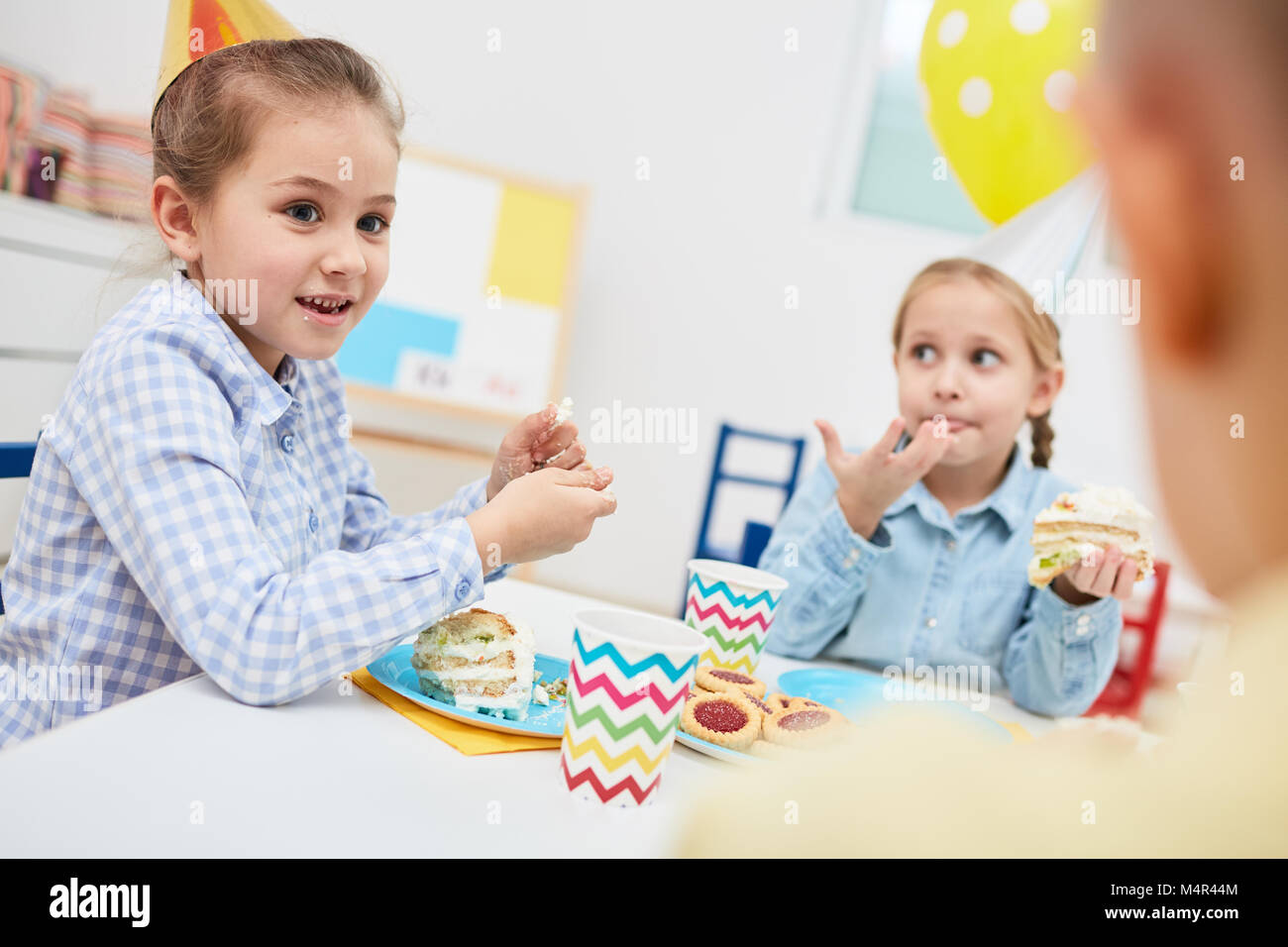 Child talking to group of children hi-res stock photography and images ...