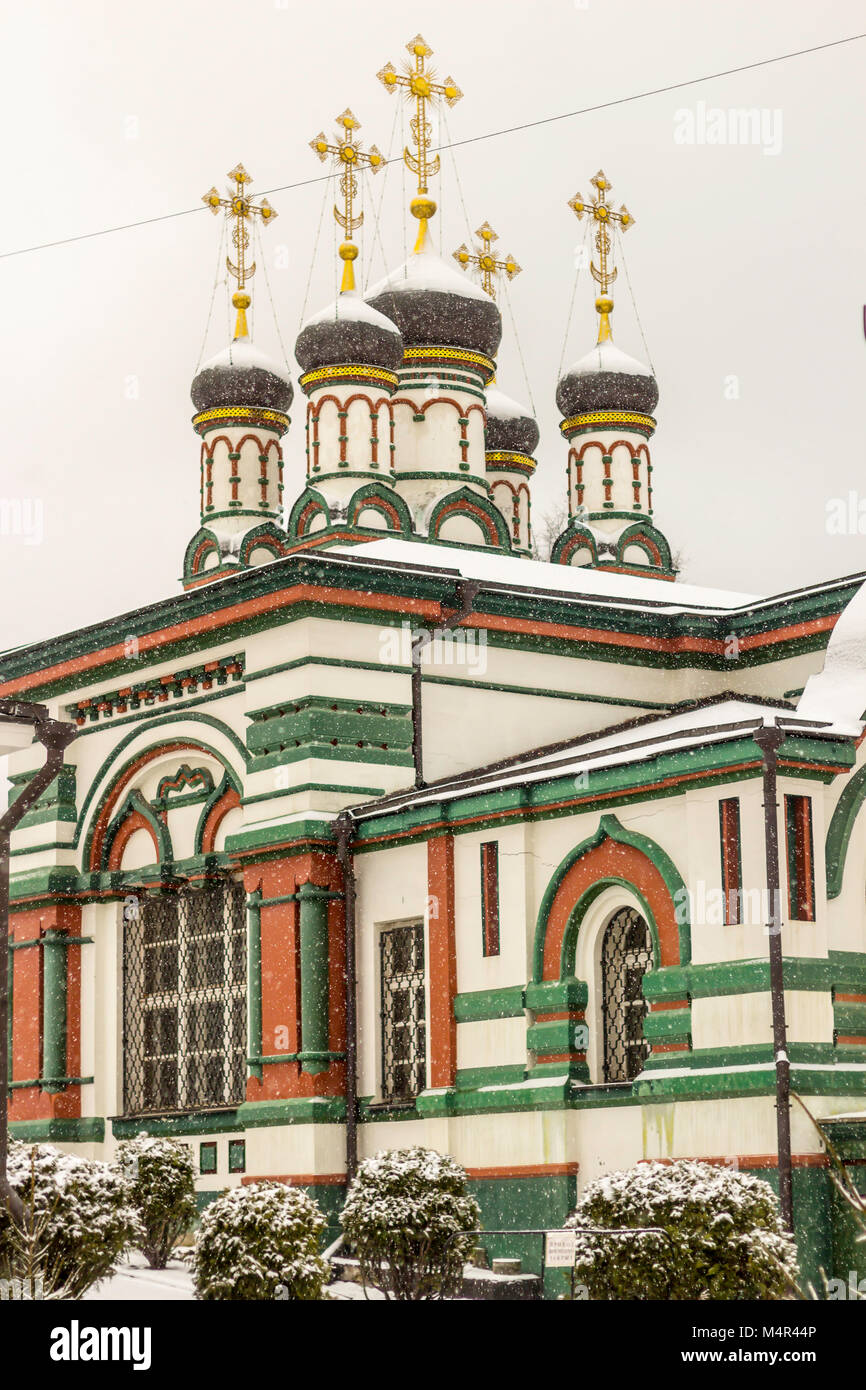 Orthodox church, with multi-colored walls and five domes, during a ...
