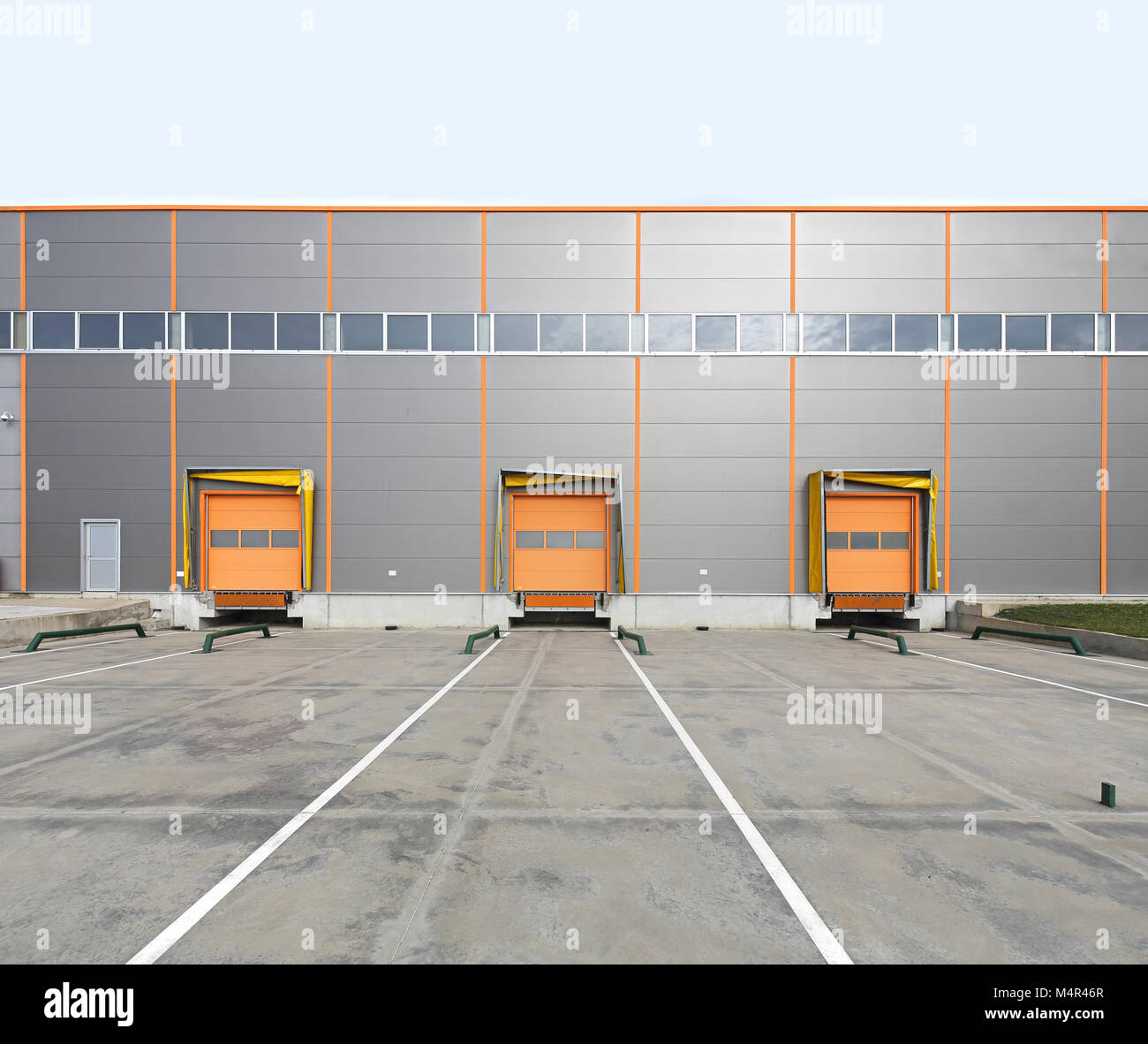 Three Cargo Doors at Warehouse Loading Bay Stock Photo - Alamy