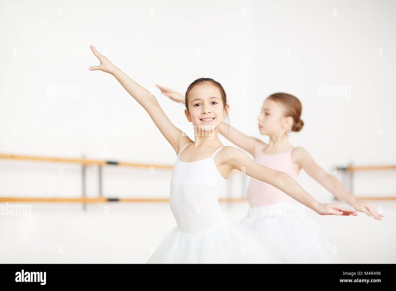 Little girl stretching arms hi-res stock photography and images - Alamy