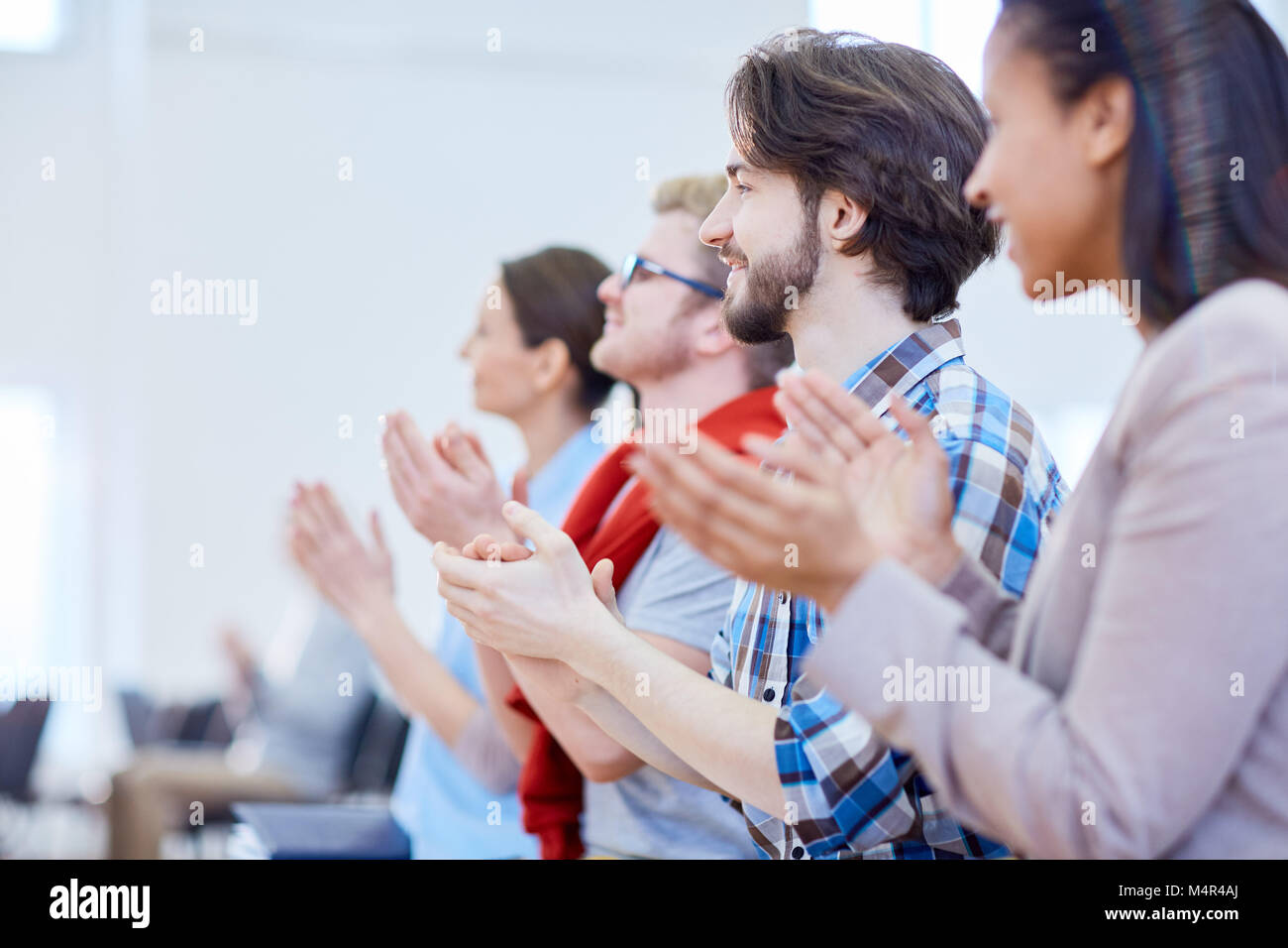 Applauding to speaker Stock Photo - Alamy