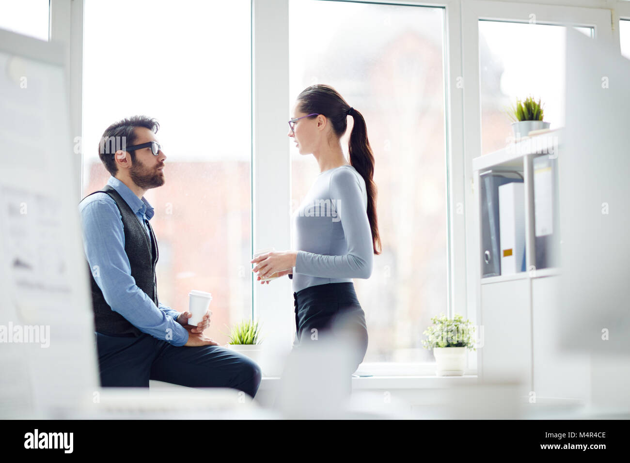 Conversation at break Stock Photo - Alamy