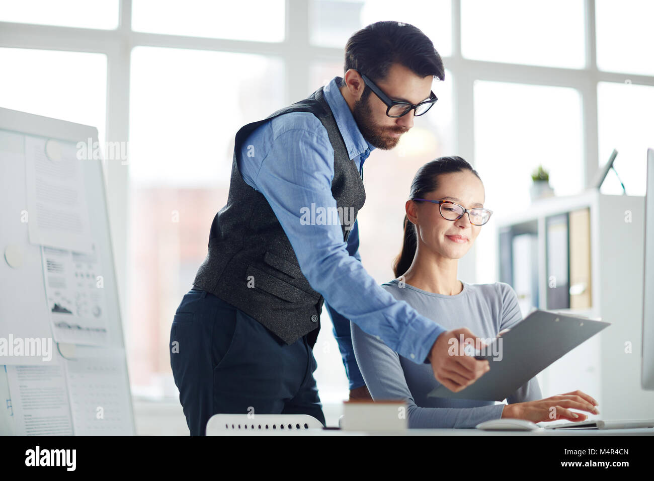 Secretary and boss Stock Photo - Alamy