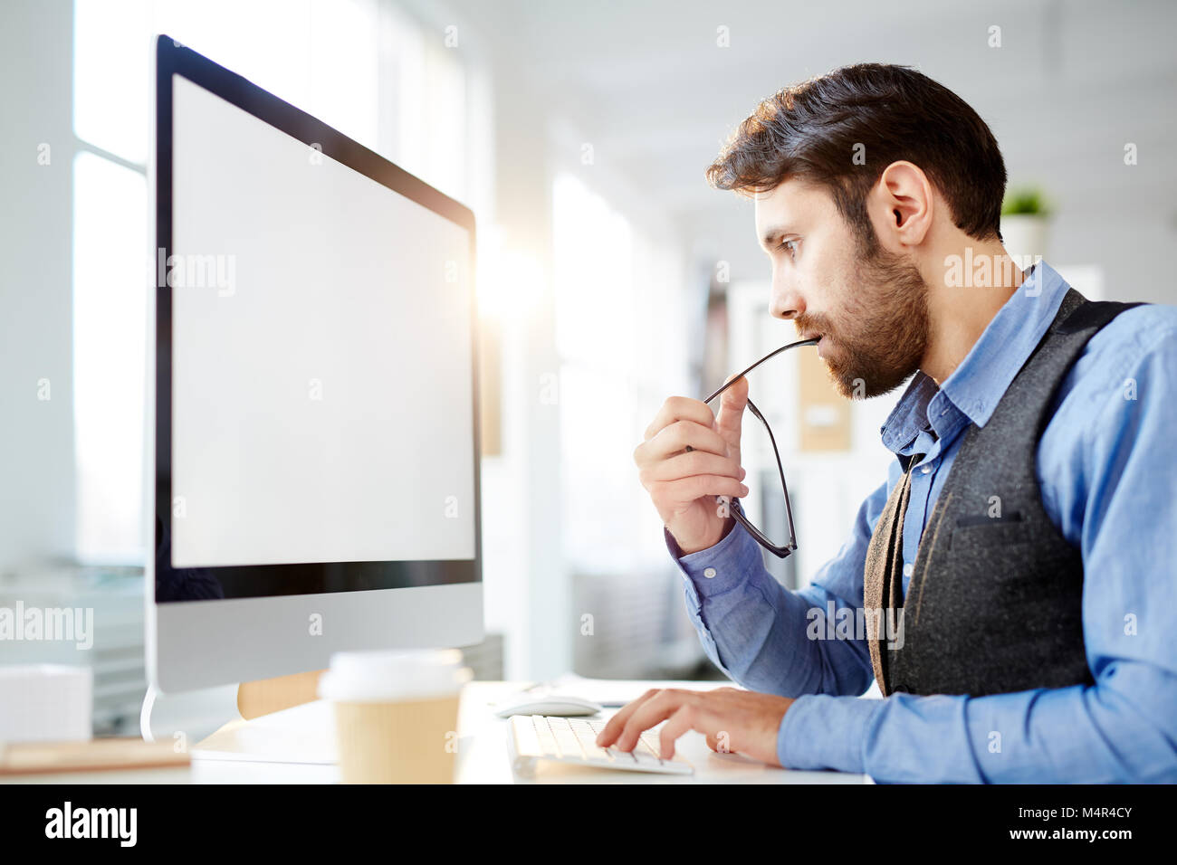 Serious office worker Stock Photo - Alamy