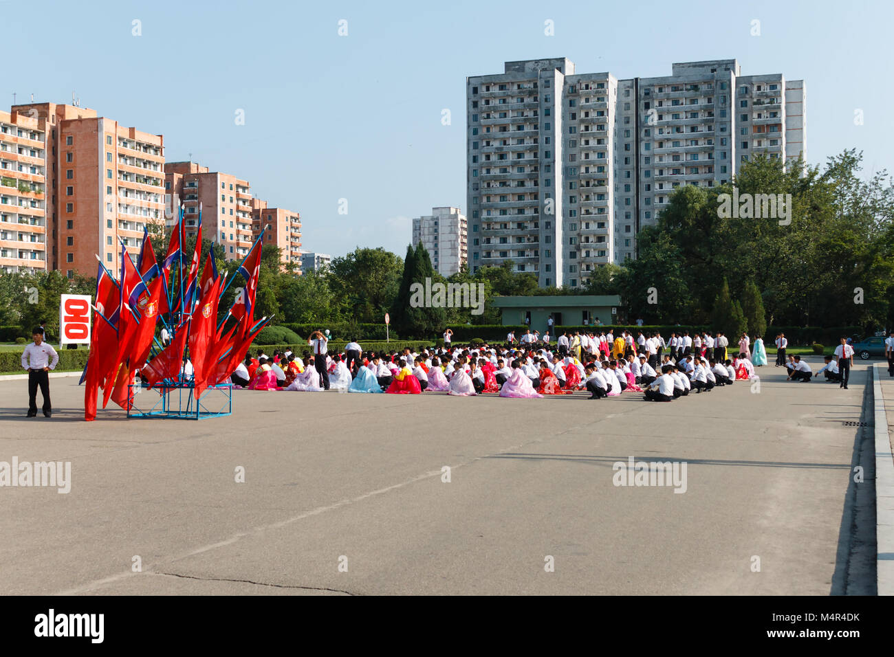 Pyongyang, North Korea - July 27, 2014: Korean Men and women are ...