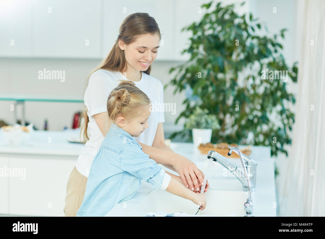 Help in the kitchen Stock Photo - Alamy