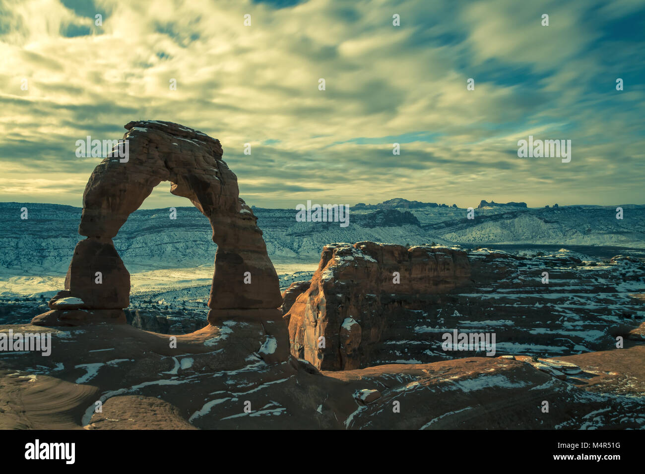 Delicate Arch and the slow moving clouds on a winter morning, Arches ...