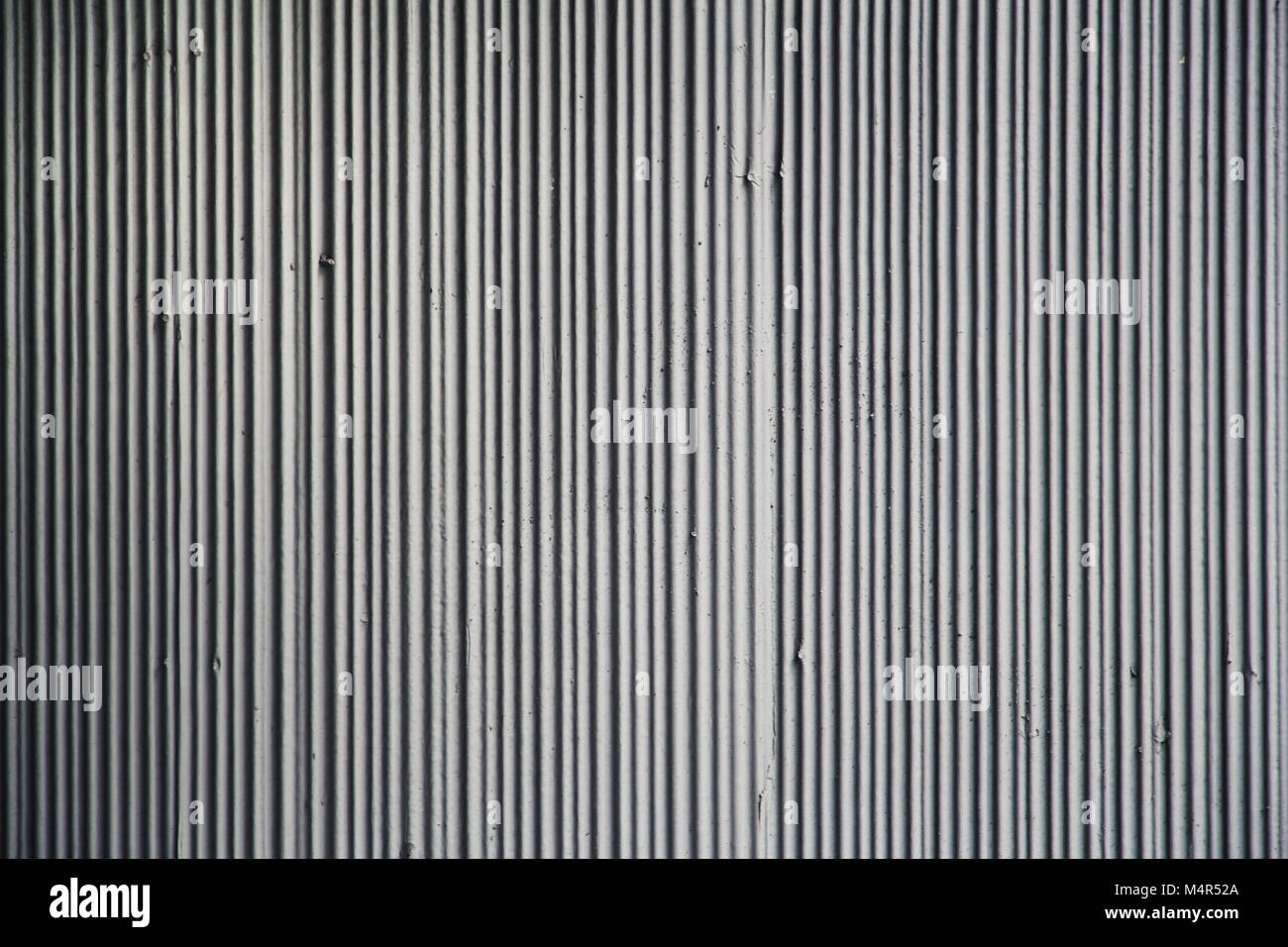 Textured concrete wall with vertical lines in grey as a texture or for ...