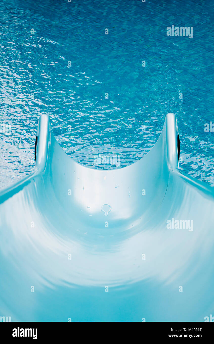 Beautiful blue swimming pool and water slide with water drops for ...
