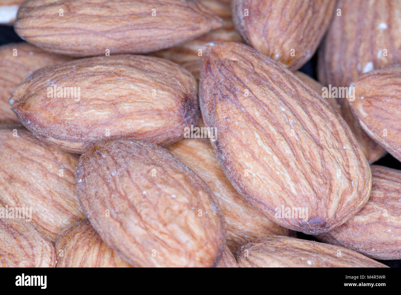 Close up of raw natural whole almond nuts Stock Photo - Alamy
